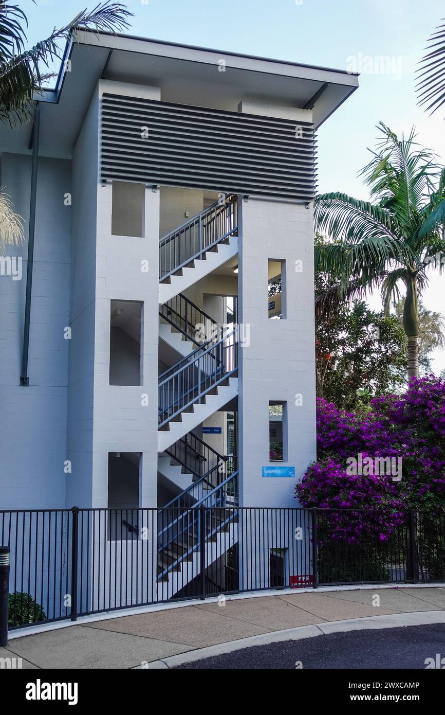 exterior staircase on a white building commonly used in hotels and ...
