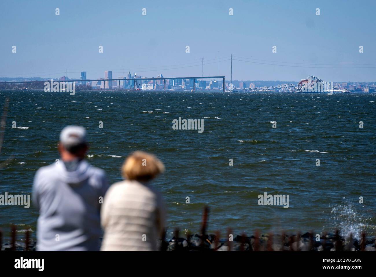 Baltimore, United States. 29th Mar, 2024. People gather to view the ...