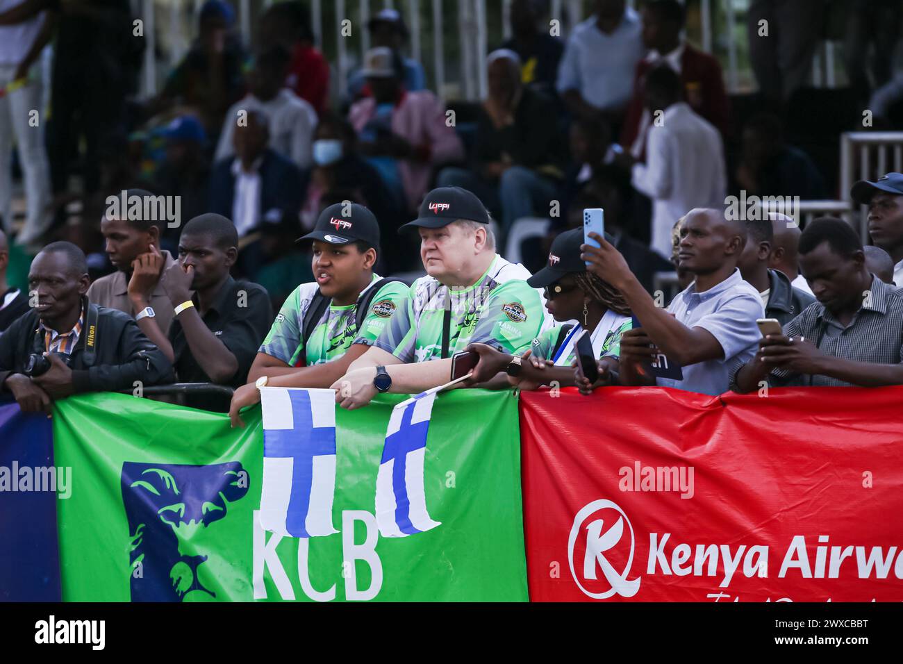 Kenyan and international fans cheer rally drivers during the official ...