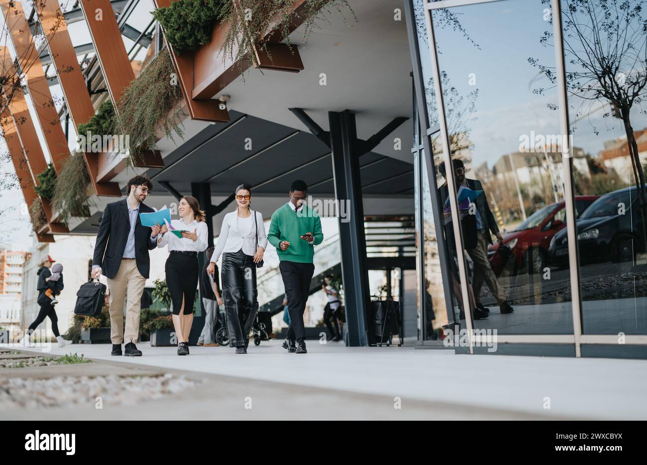 Dynamic start-up team collaborates during an outdoor meeting at a ...