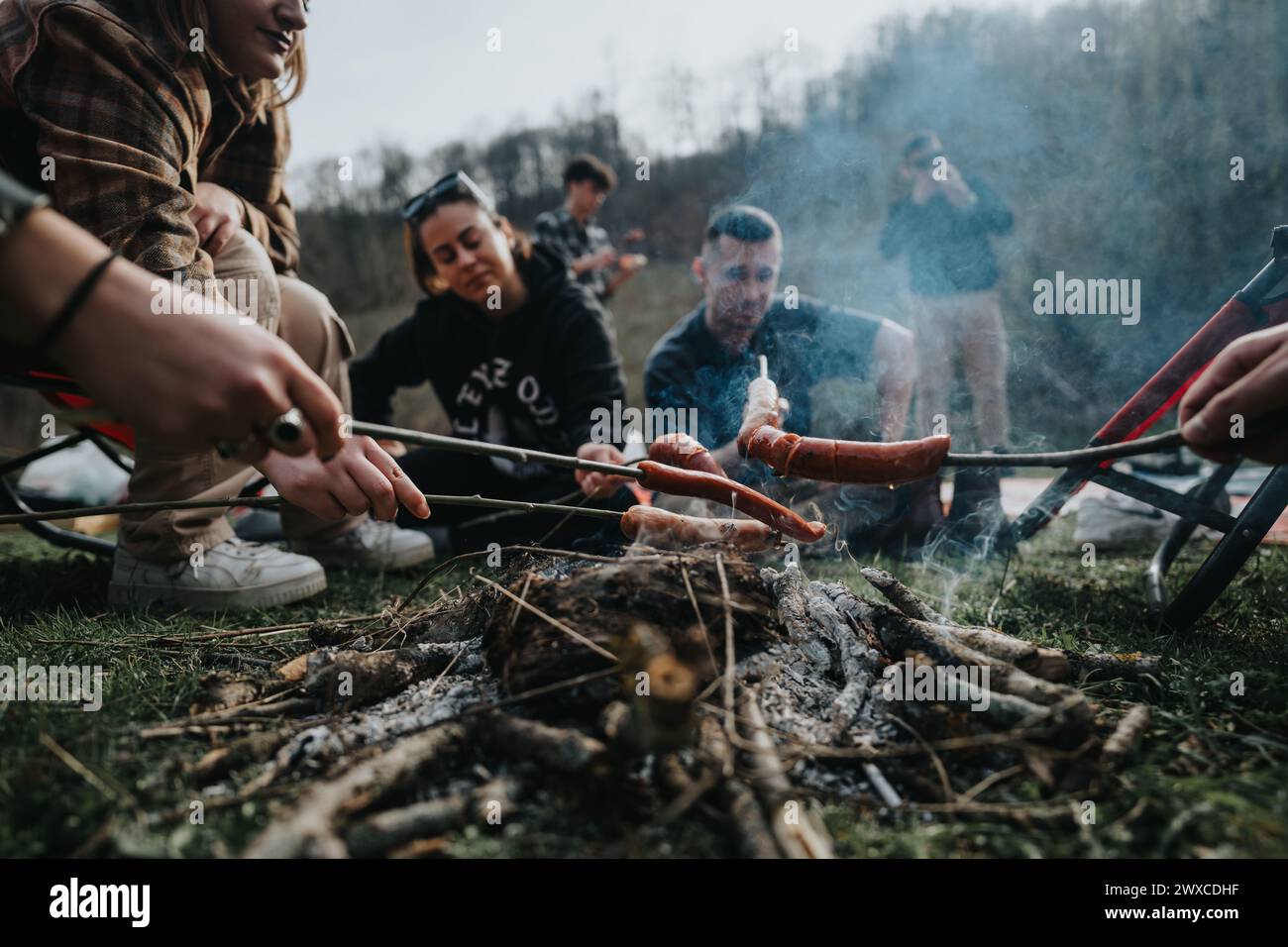 Woman cooking over open fire hi-res stock photography and images - Alamy