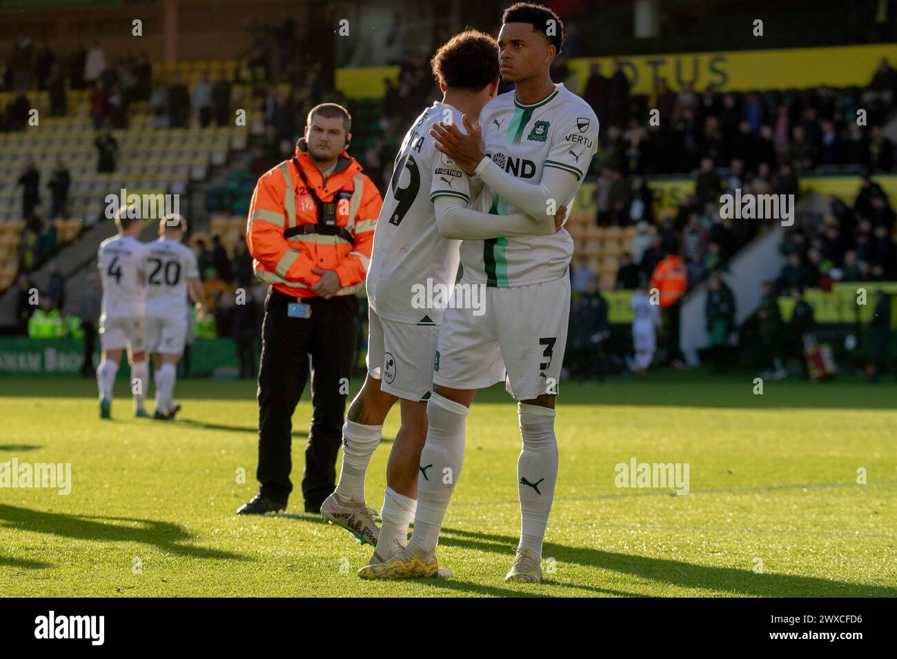 A dejected Matthew Sorinola of Plymouth Argyle with Lino Sousa of ...