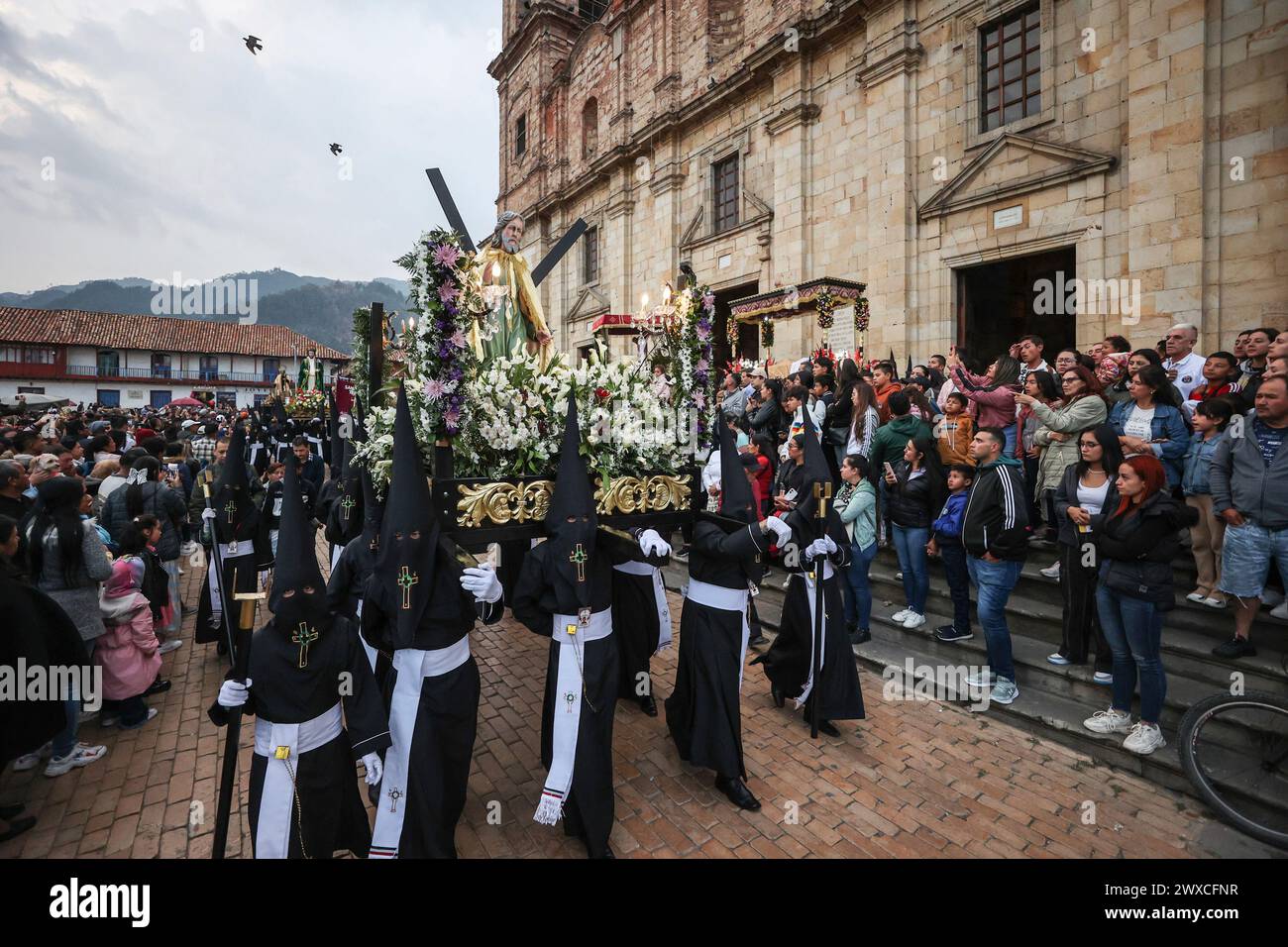 Members of the Nazarene brotherhood take part in a Holy Week procession ...