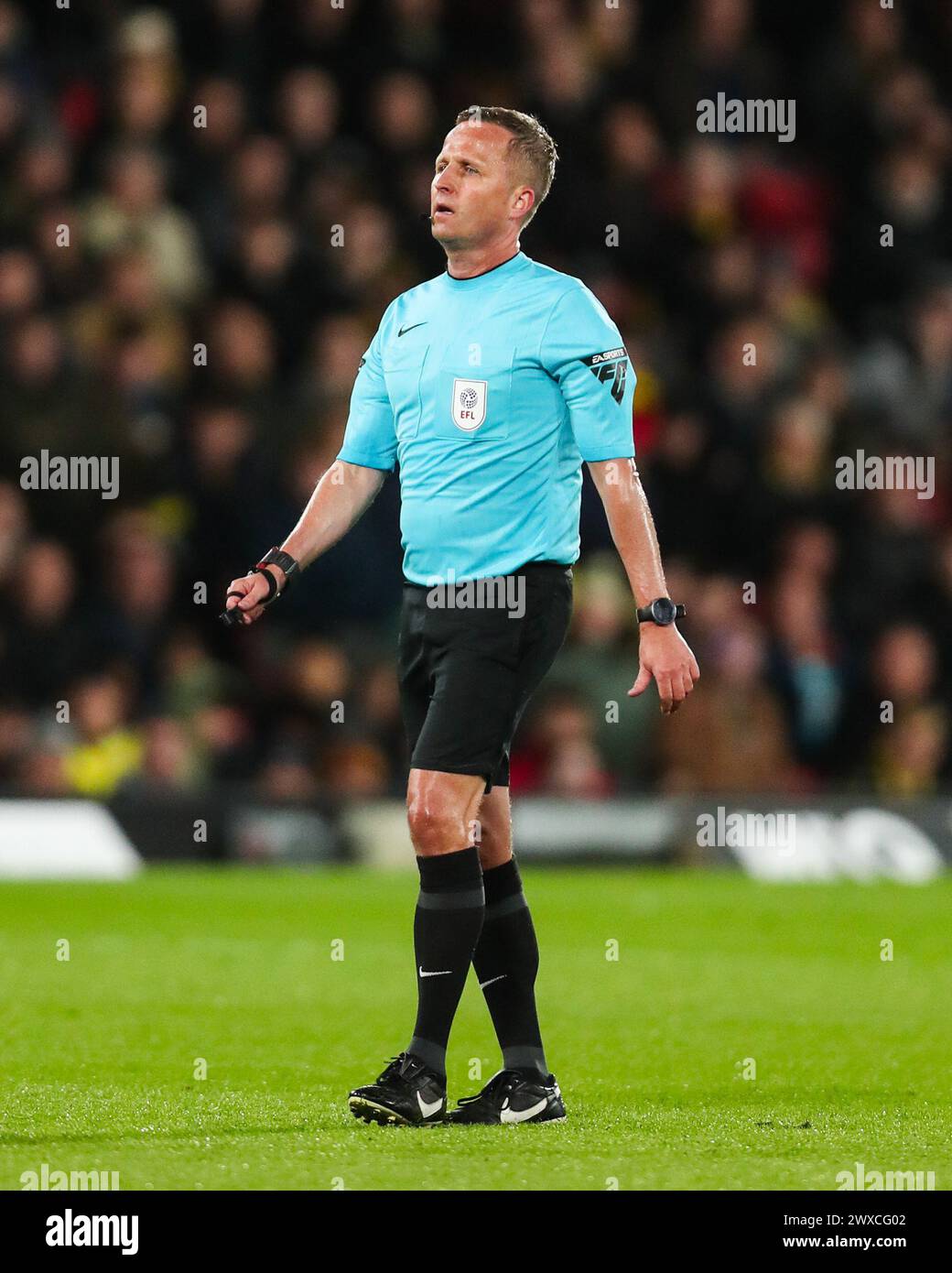 Watford, UK. 29th Mar, 2024. Referee David Webb during the Watford FC v ...