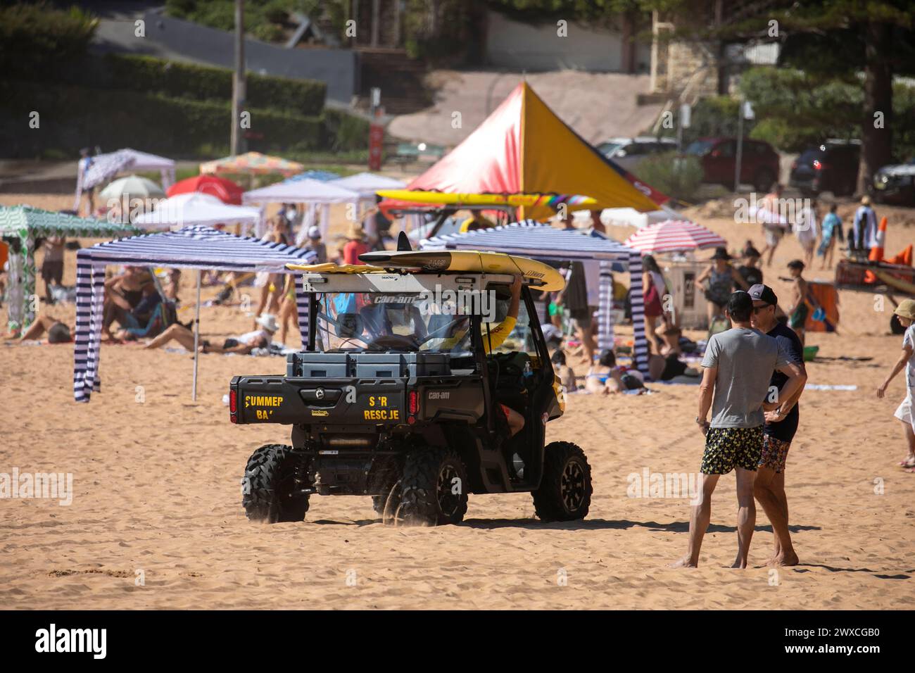 Beach patrol surf rescue Can Am vehicle on crowded Palm Beach in Sydney ...