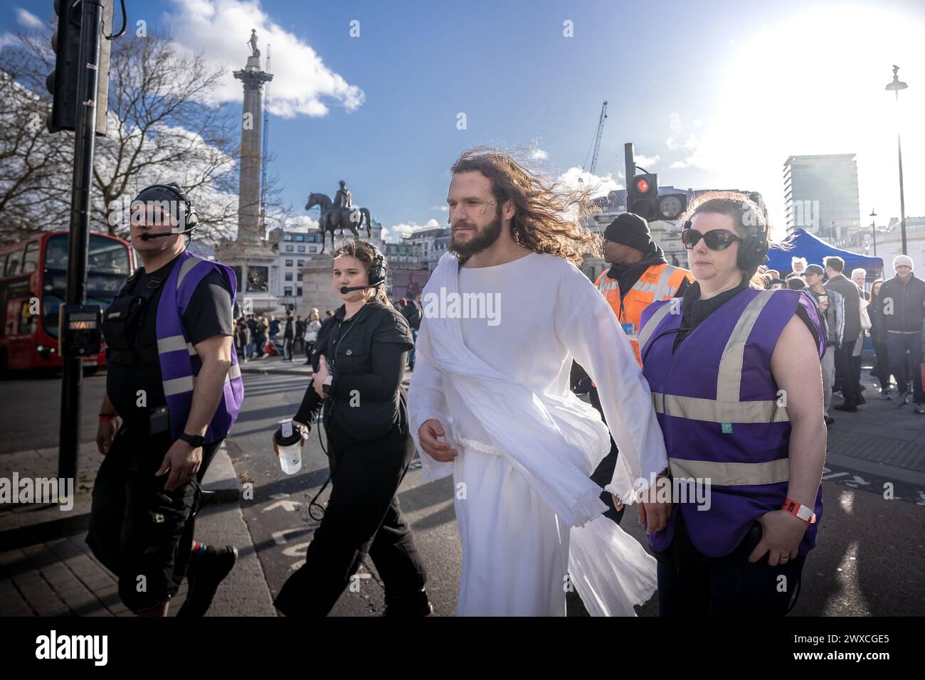 London, UK. 29th March, 2024. Peter Bergin as Jesus with his security ...