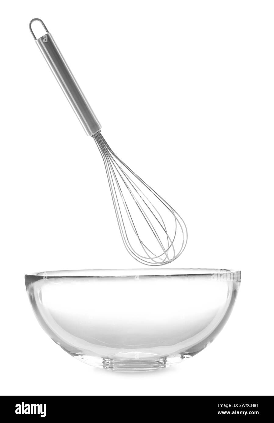 Metal whisk and glass bowl isolated on white. Cooking utensils Stock ...