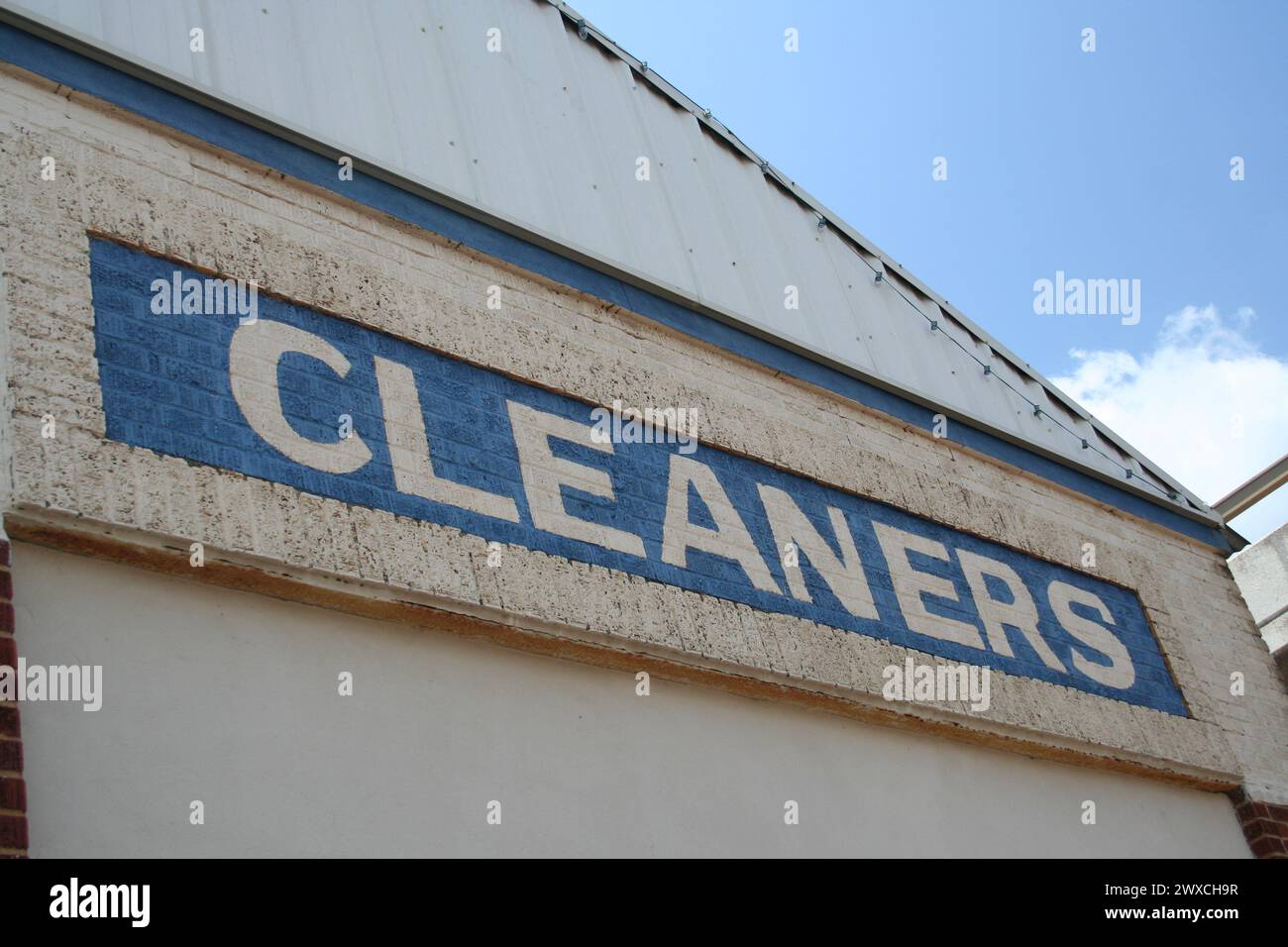 Vintage Cleaners Sign on Historic Brick Building Front Stock Photo - Alamy