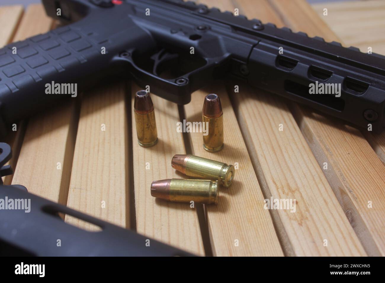 Semi Automatic Handgun on Wooden Table With Ammunition Stock Photo - Alamy