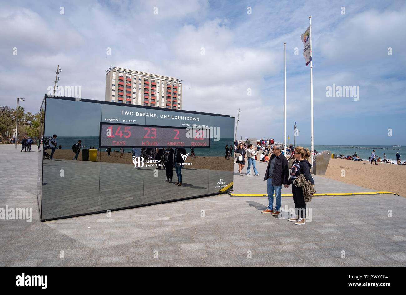 Barcelona, Spain. 29th Mar, 2024. Two people are seen looking at the ...