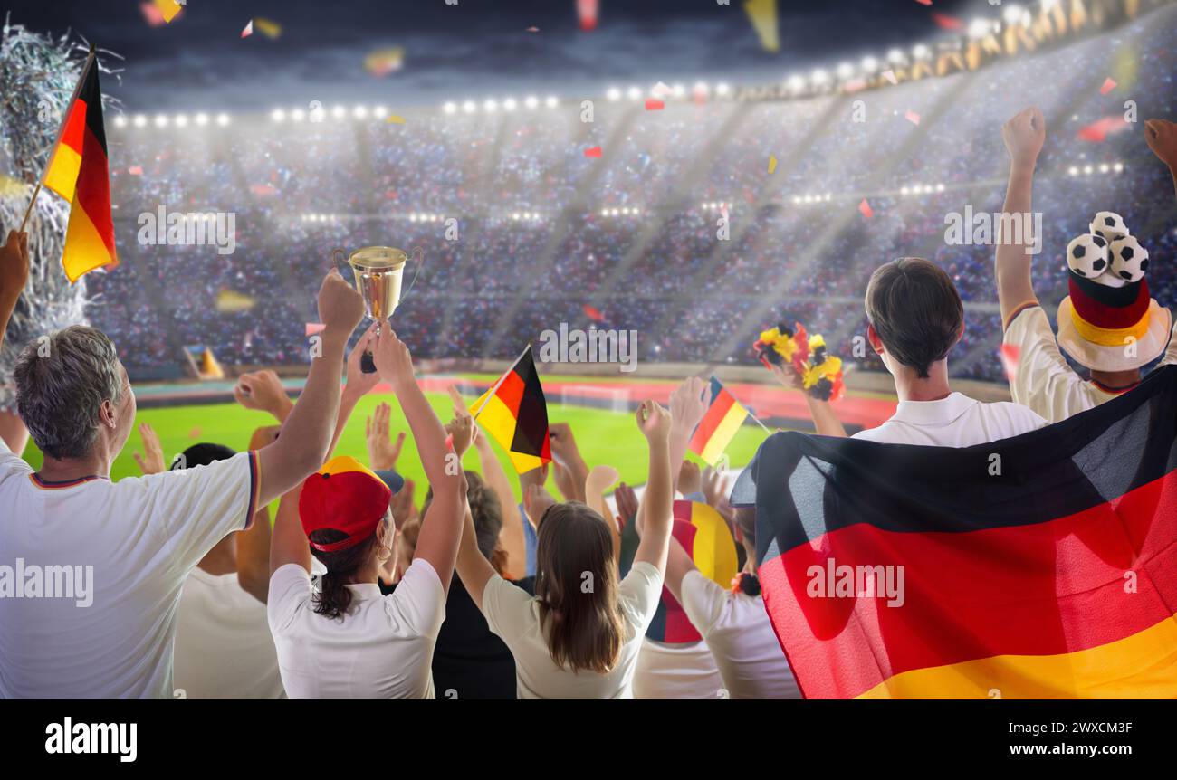 Germany football supporter on stadium. German fans on soccer pitch ...