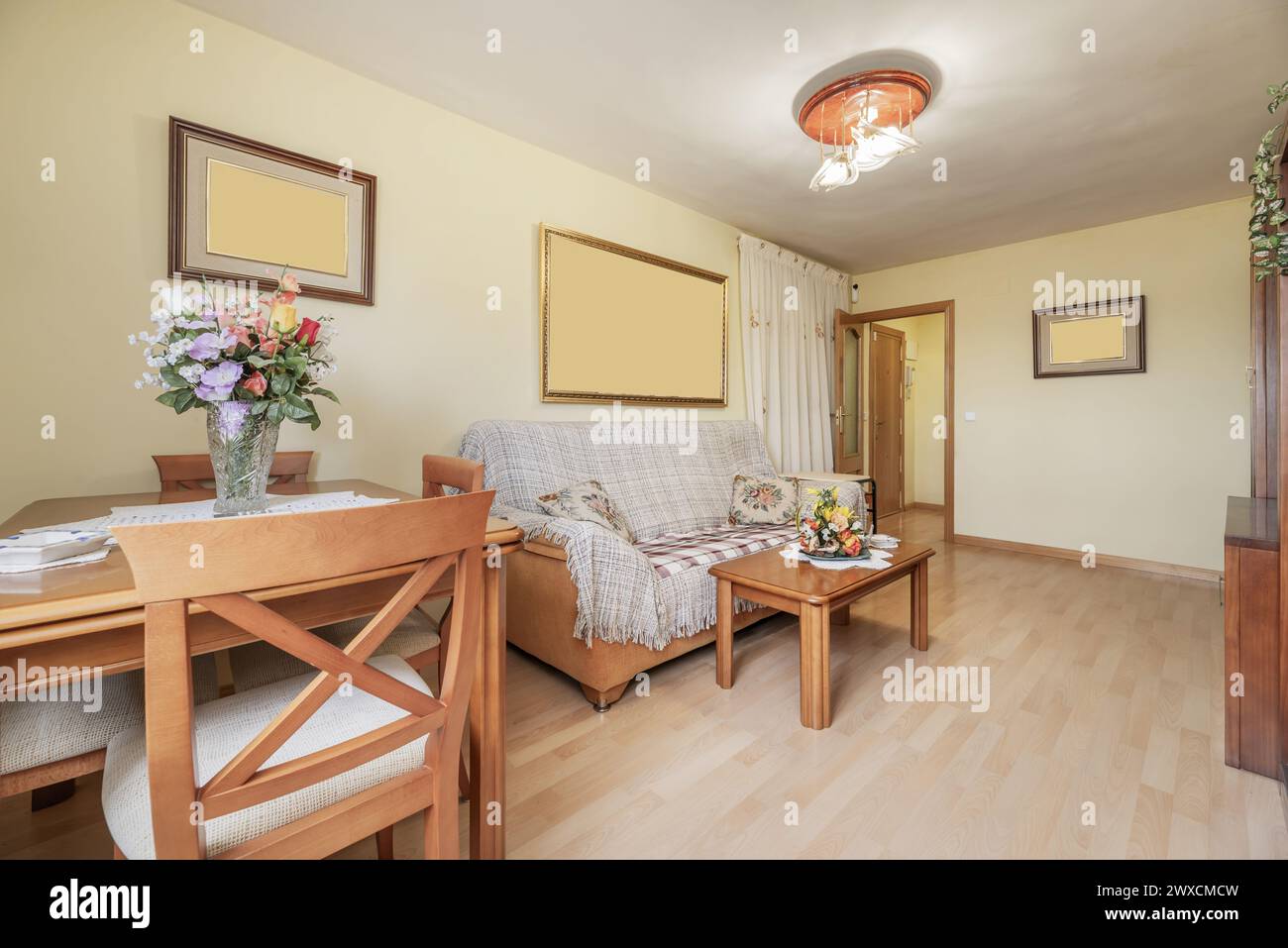 living room of a house furnished with cherry-colored furniture, sofas ...
