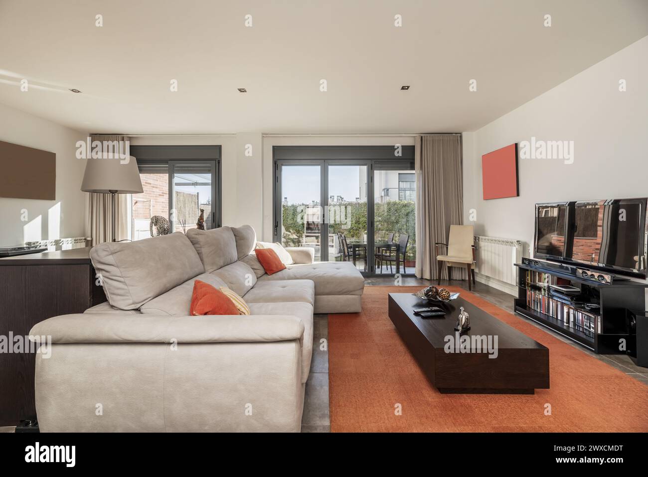 Living room on the ground floor of a detached house with a large sofa ...