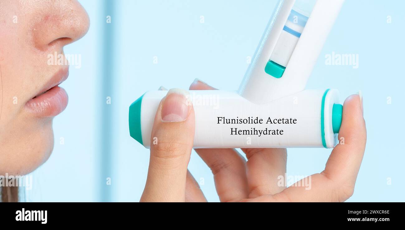 Flunisolide acetate hemihydrate medical inhaler, conceptual image. A ...