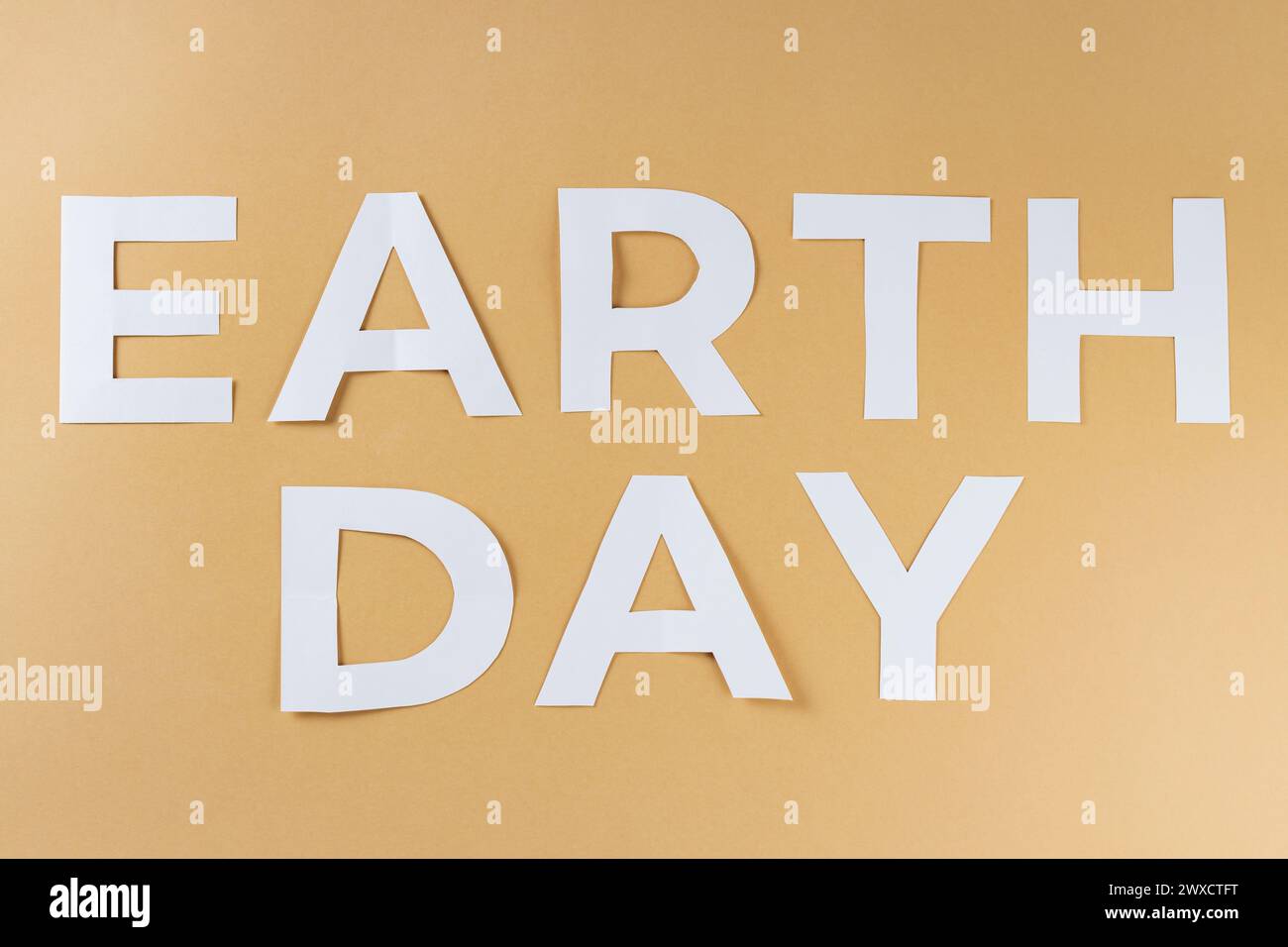 Earth Day Inscription with White Letters on Beige Background Stock ...