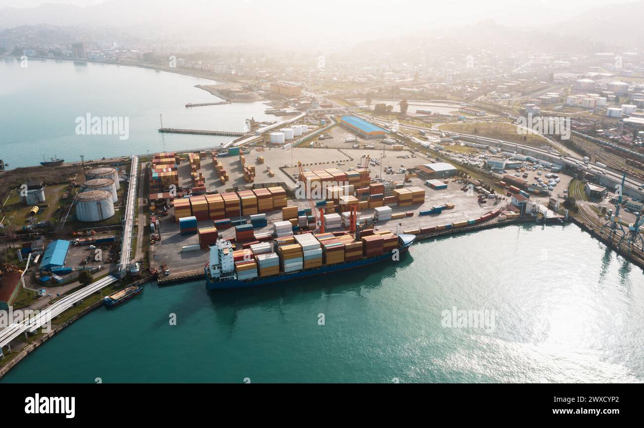 Aerial view of cargo port with containers at dawn. Reflects the hustle ...