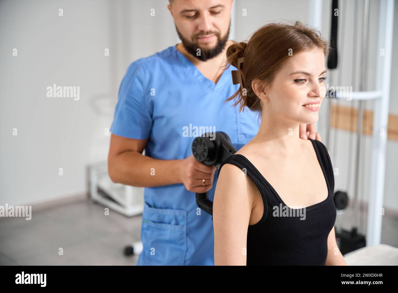 Doctor massages a patients back with a special massager Stock Photo - Alamy