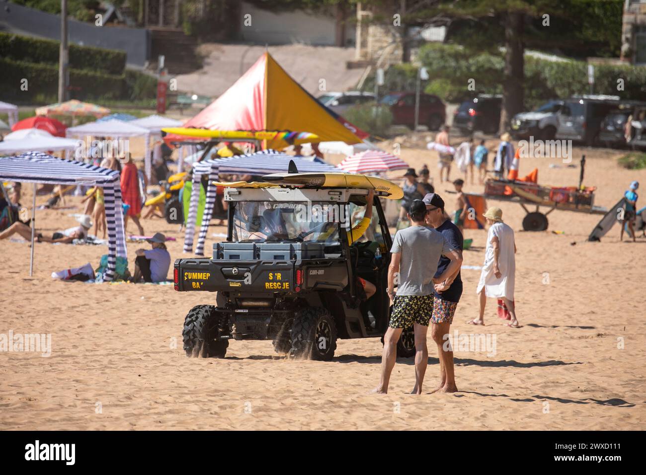 Beach patrol surf rescue Can Am vehicle on crowded Palm Beach in Sydney ...