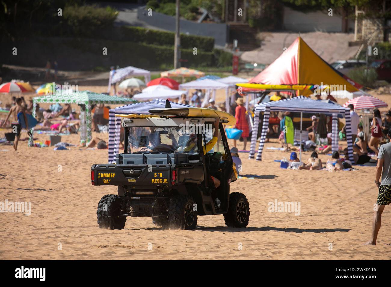 Beach patrol surf rescue Can Am vehicle on crowded Palm Beach in Sydney ...