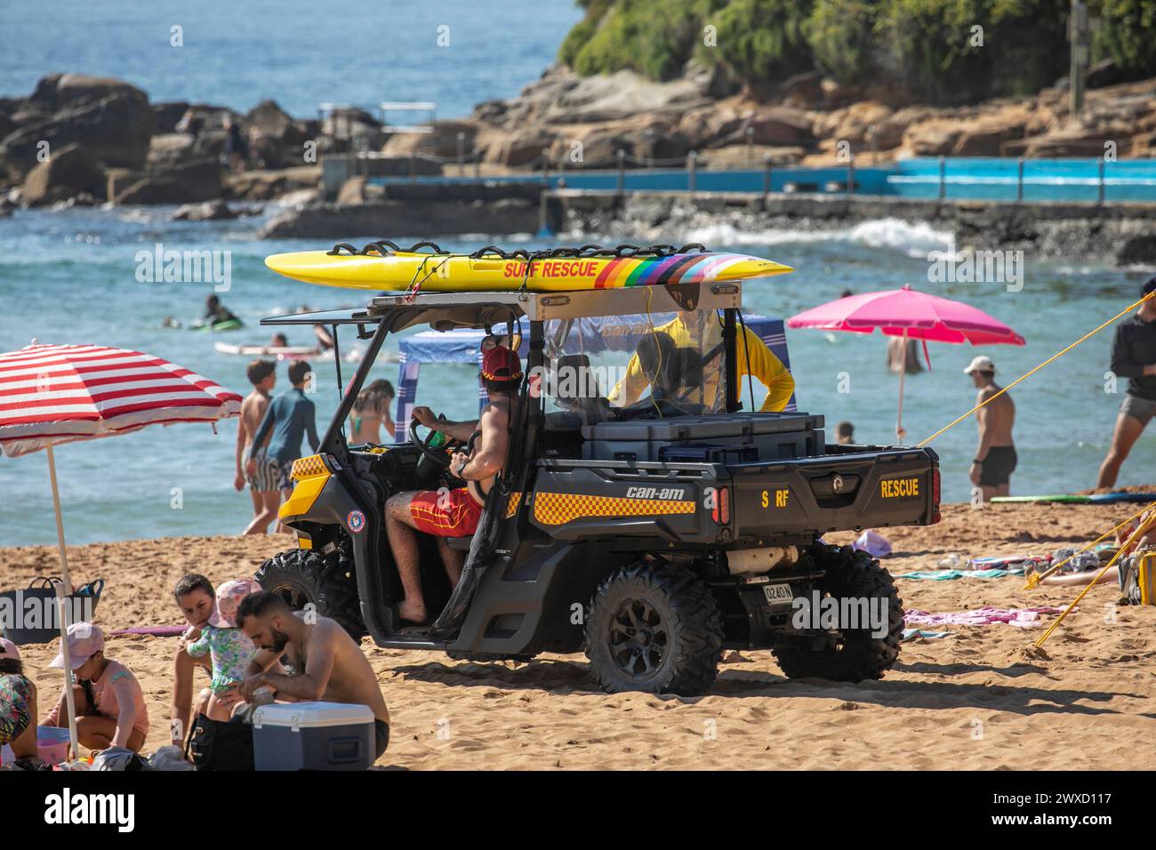 Beach patrol surf rescue Can Am vehicle on crowded Palm Beach in Sydney ...