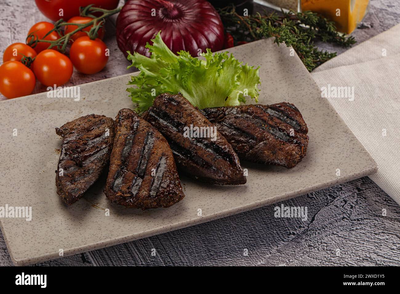 Grilled diet beef liver steak in the plate Stock Photo - Alamy