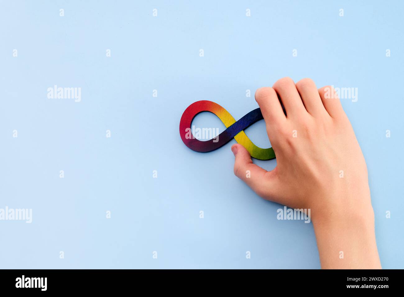 Autistic boy hands and rainbow eight infinity symbol. Autism awareness ...