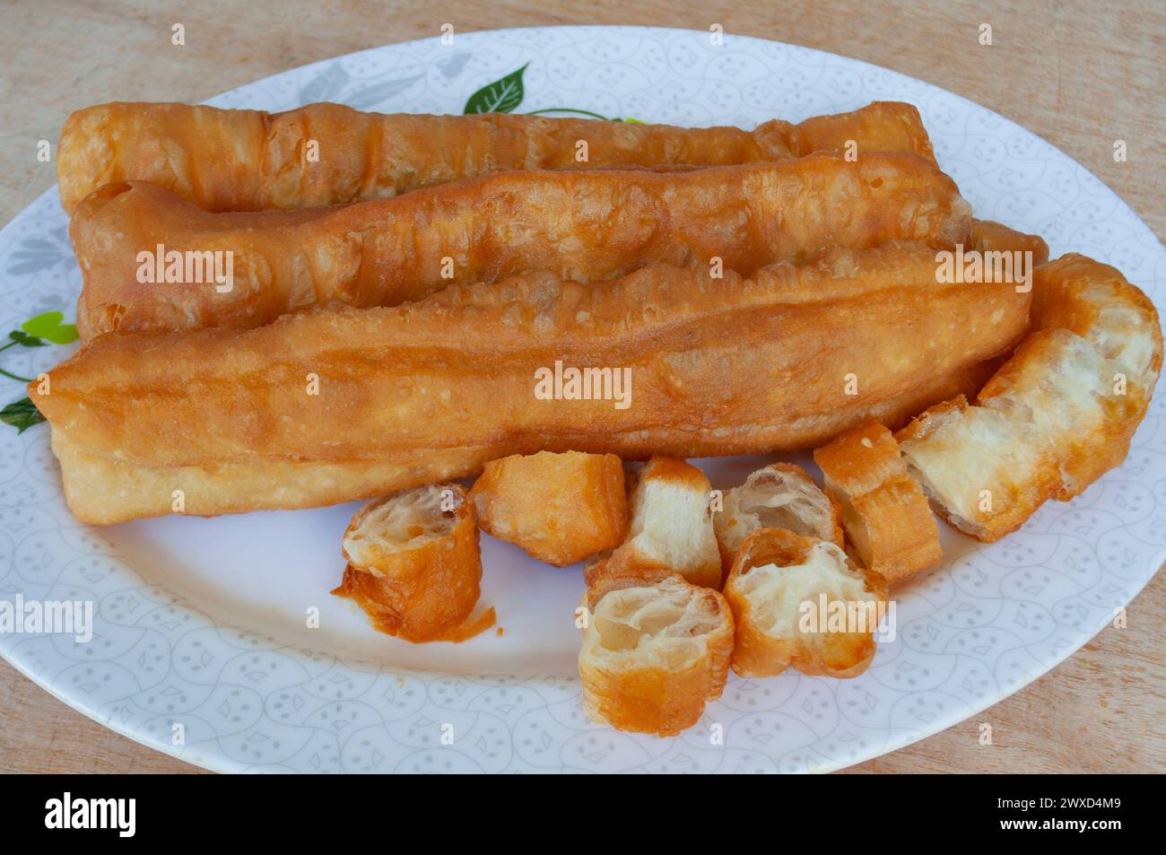 Top view of cakoi or Youtiao on white plate. Asian food concept Stock ...