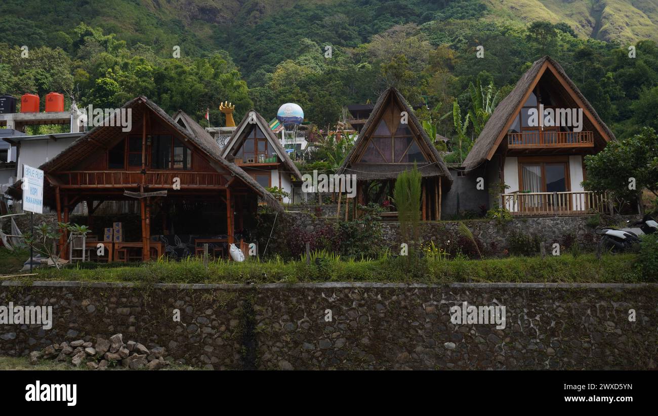 Lodging in the form of a traditional house made of wood on the side of ...