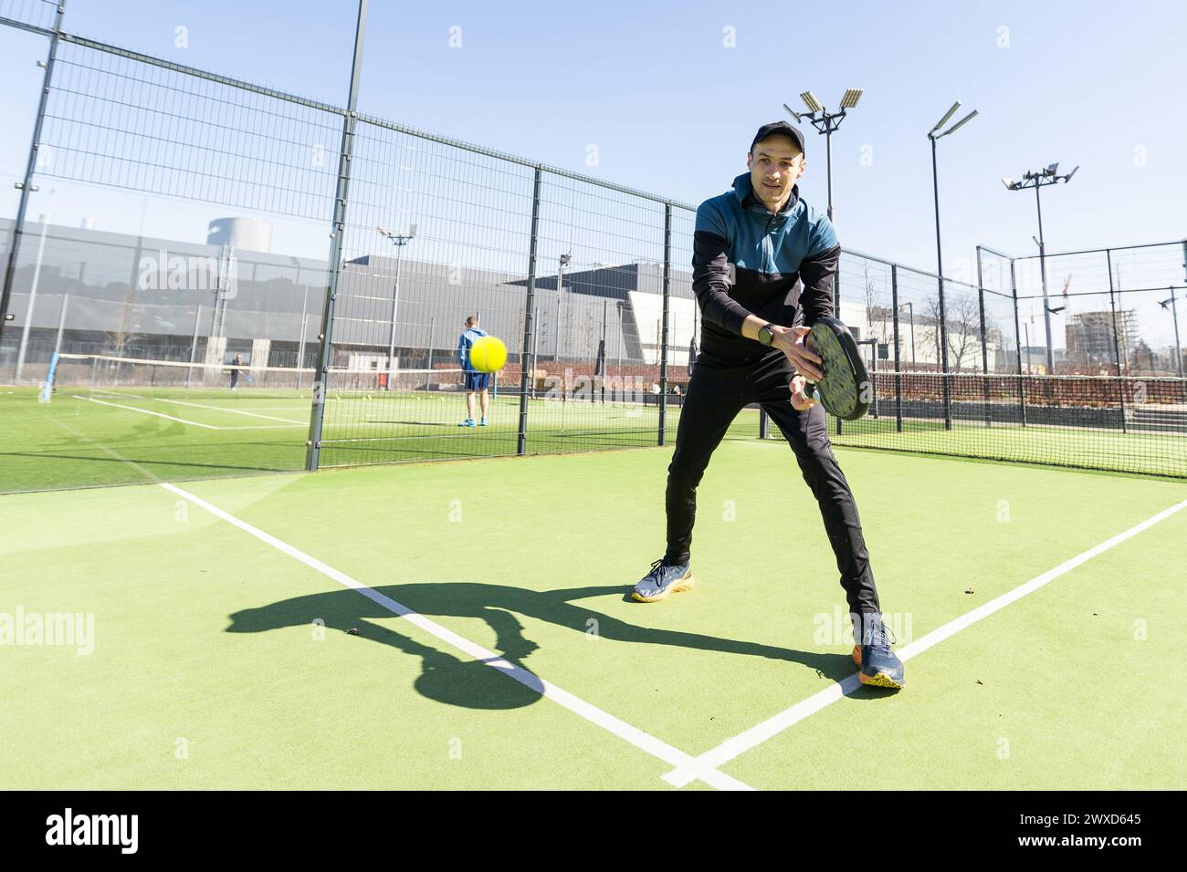 Man playing paddle tennis. Jumping and shooting the ball Stock Photo ...