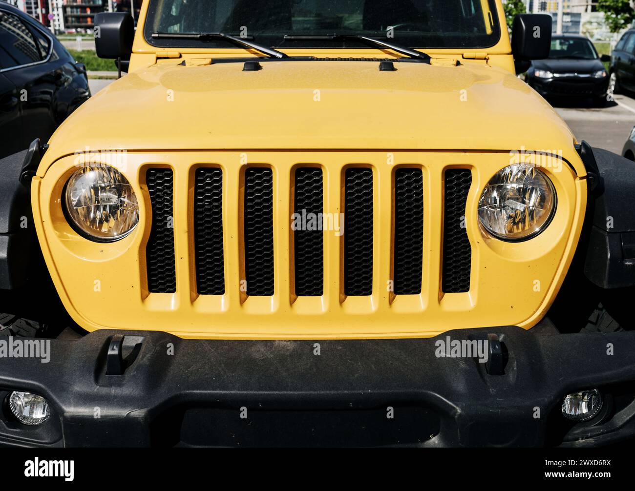 Mid-size SUV modern car on parking. front view of the auto headlights ...