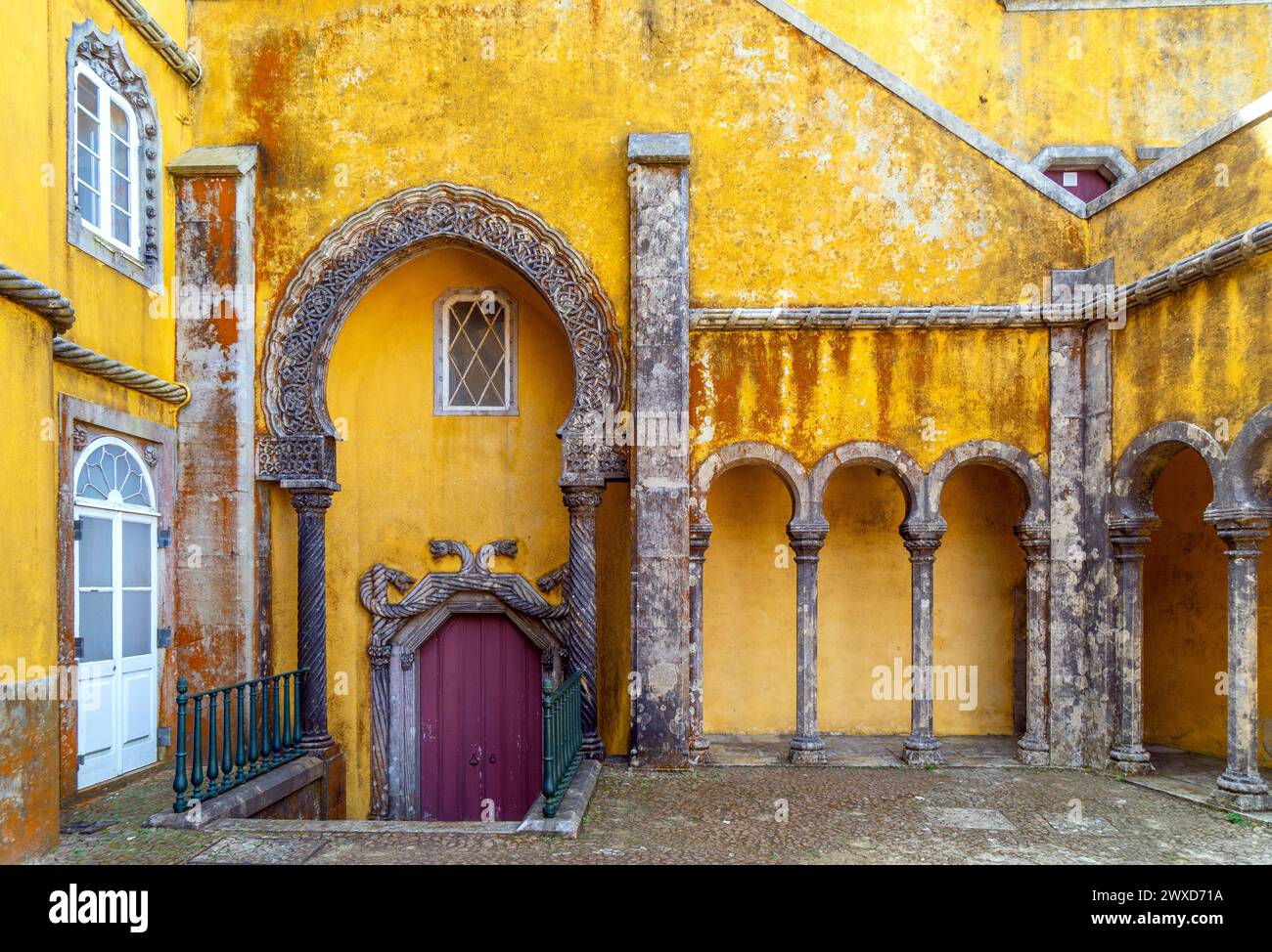 Interior of the arched courtyard with beautifully decorated arches and ...