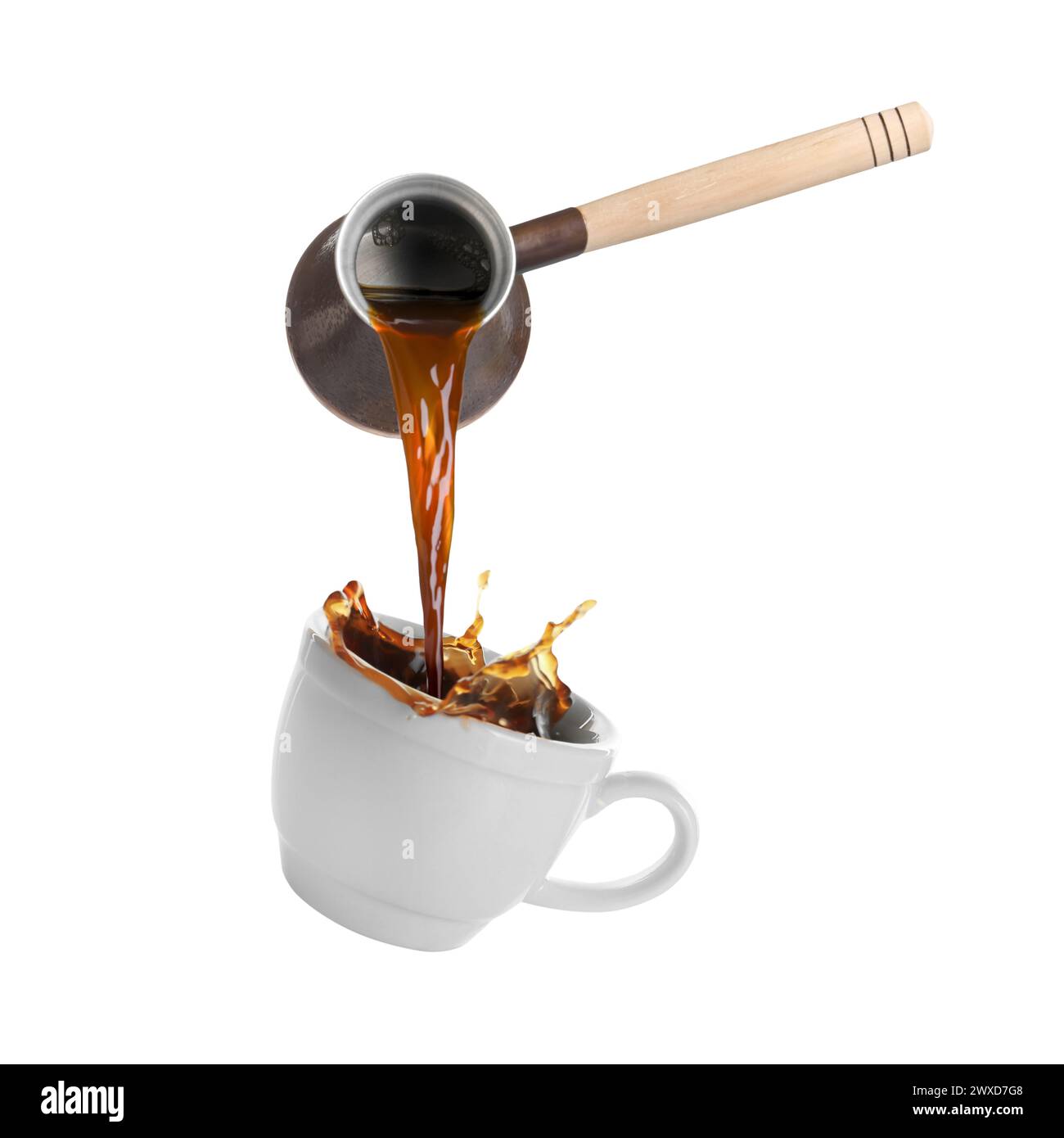 Pouring freshly brewed aromatic coffee from turkish pot into cup ...