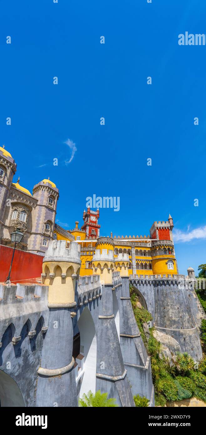 Exterior view of the Pena Palace with yellow, red colored walls and ...