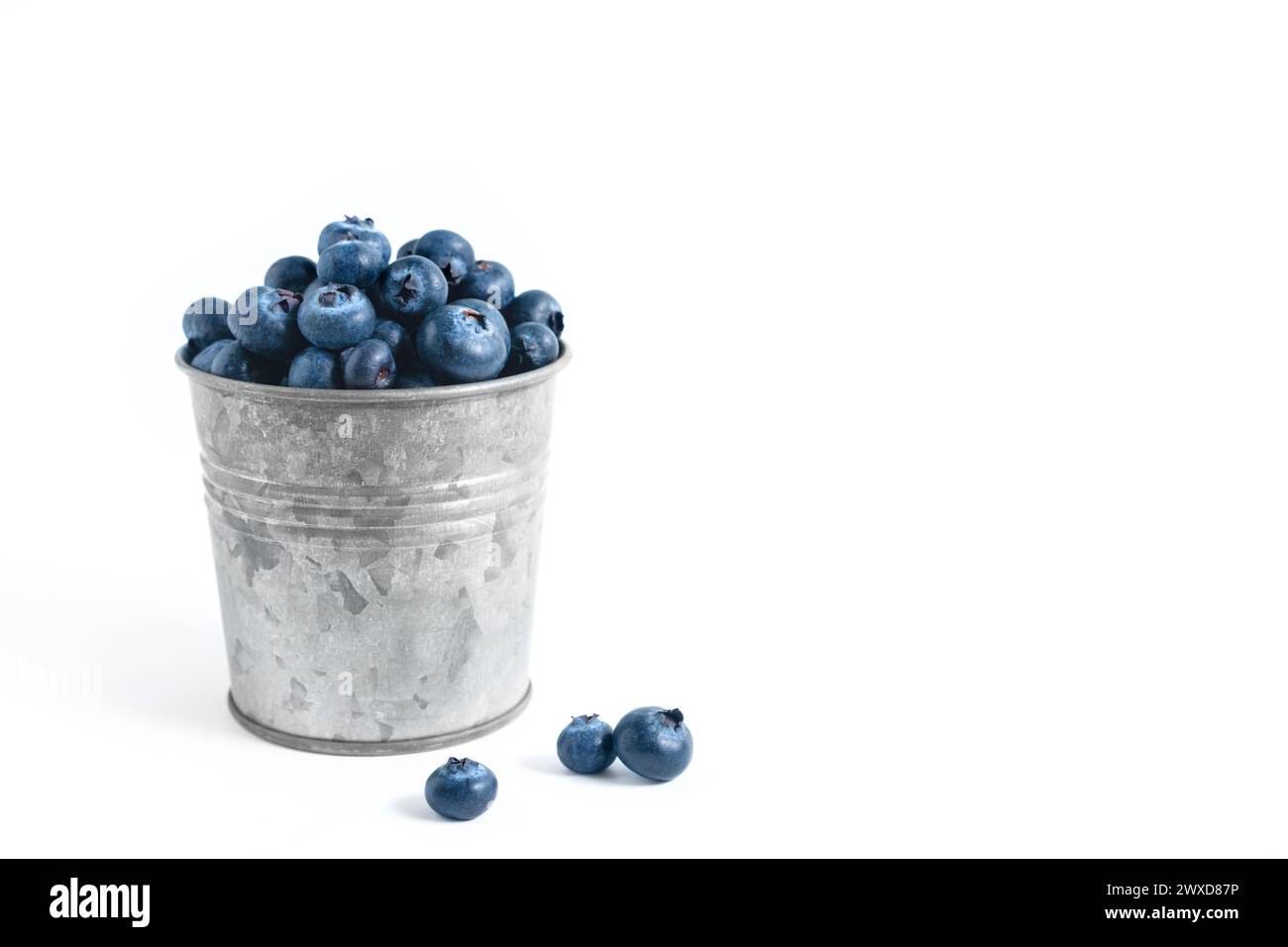 blue blueberry in a bucket on a white background, isolated Stock Photo ...