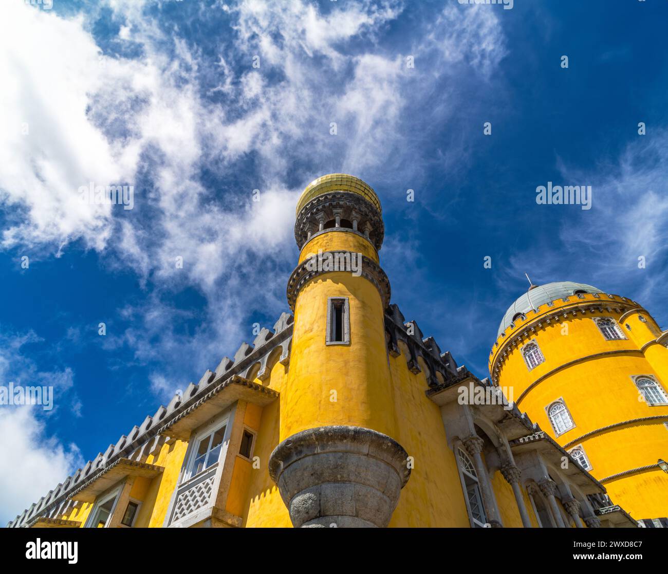 Pyramidal low angle view of a balcony in a medieval tower and the upper ...