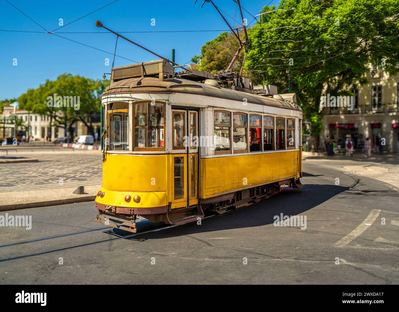 Famous and typical old yellow Portuguese tram, beautifully decorated ...