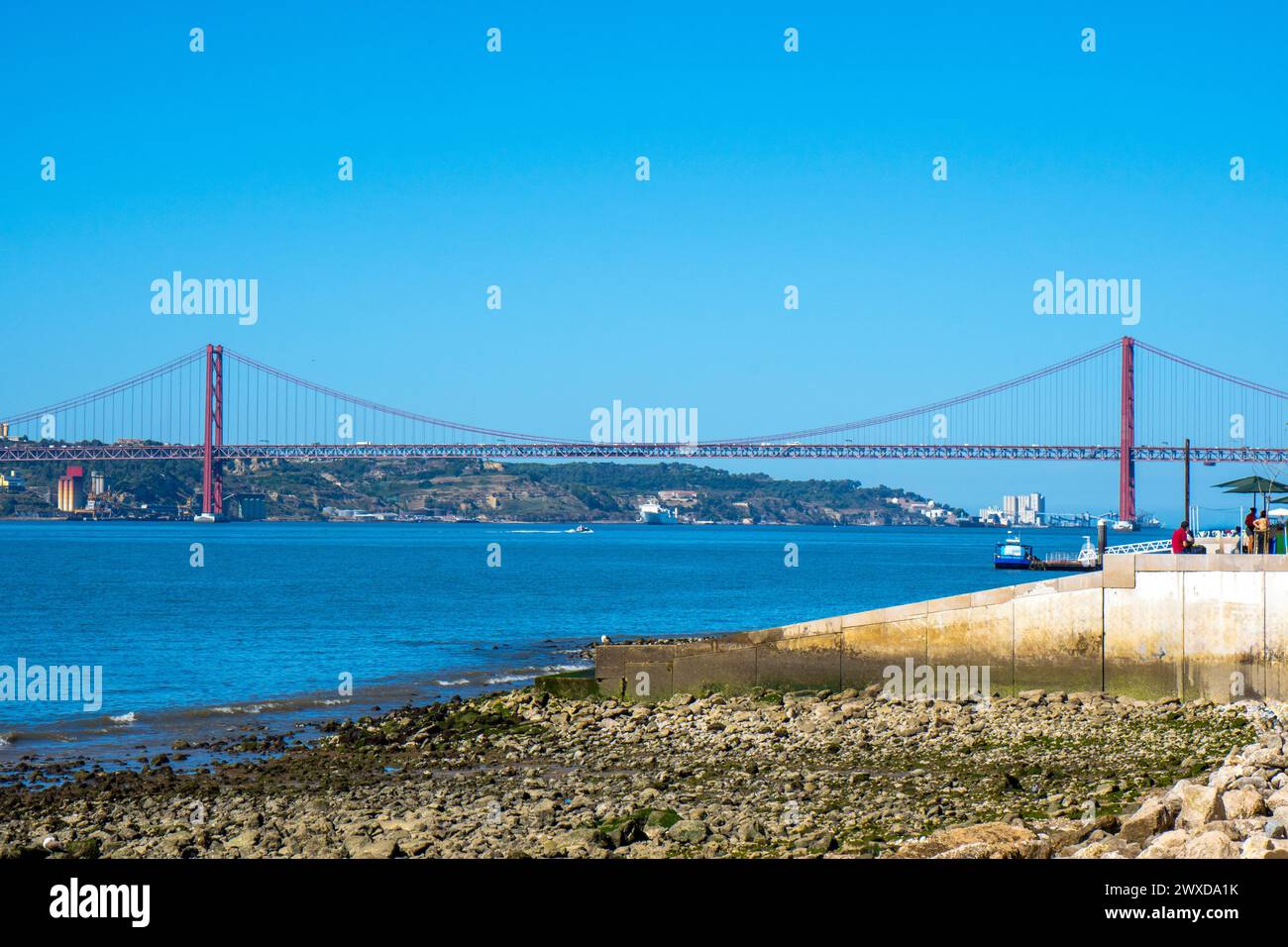 Panoramic view of Lisbon's red metal 25 de Abril steel suspension ...