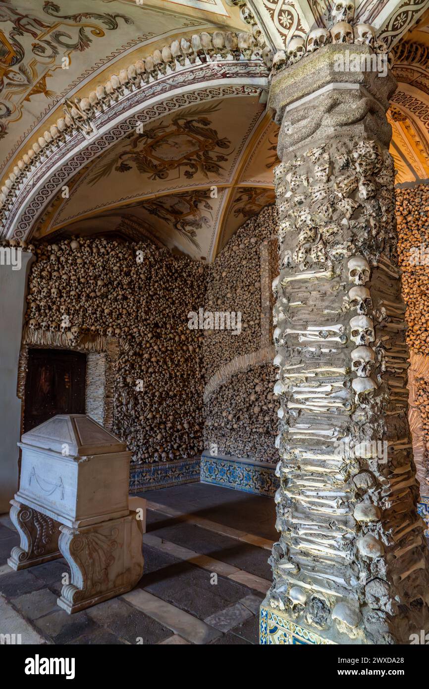 Covered column decorated with human bones and skulls, vaulted ceiling ...
