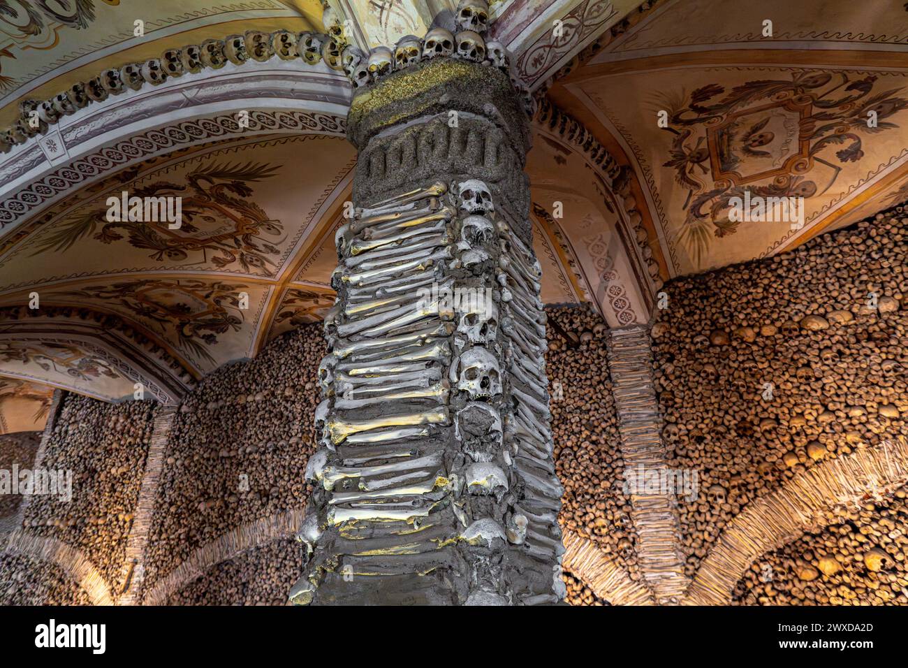 Column covered and decorated with human bones and skulls and the ...