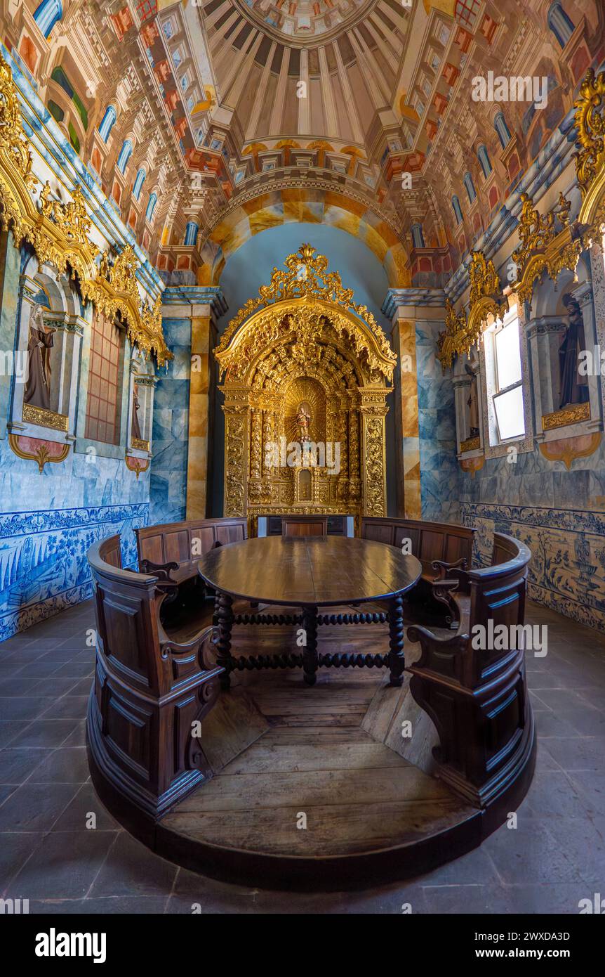 Luxuriously decorated living room with a wooden table, chapel with ...