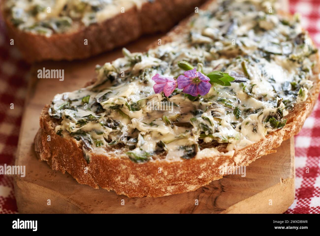A slice of bread with nettle butter - homemade spread made of wild ...