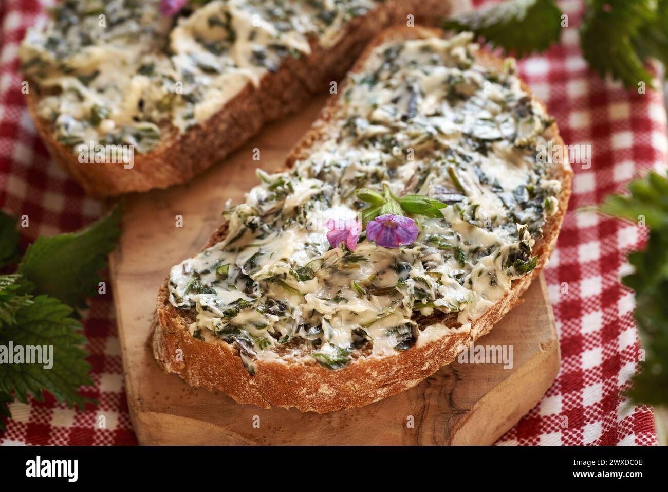 A slice of bread with nettle butter - homemade spread made of wild ...