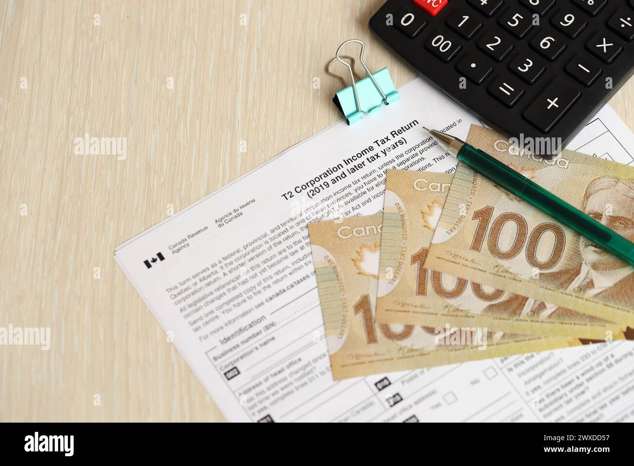 Canadian T2 tax form Corporation income tax return lies on table with ...