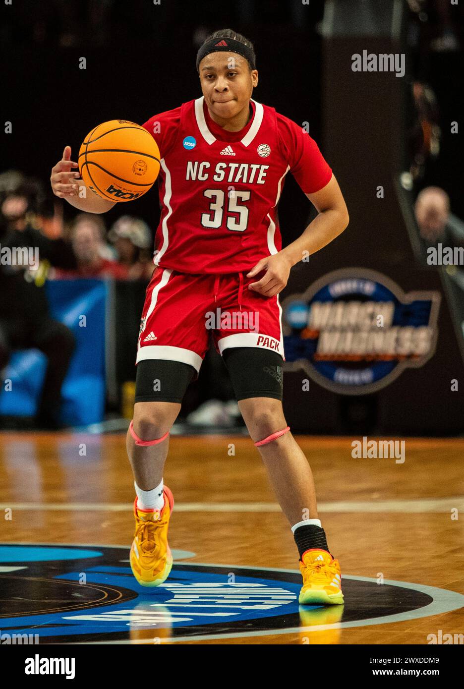 Portland, OR U.S. 29th Mar, 2024. A. NC State guard Zoe Brooks (35)sets ...
