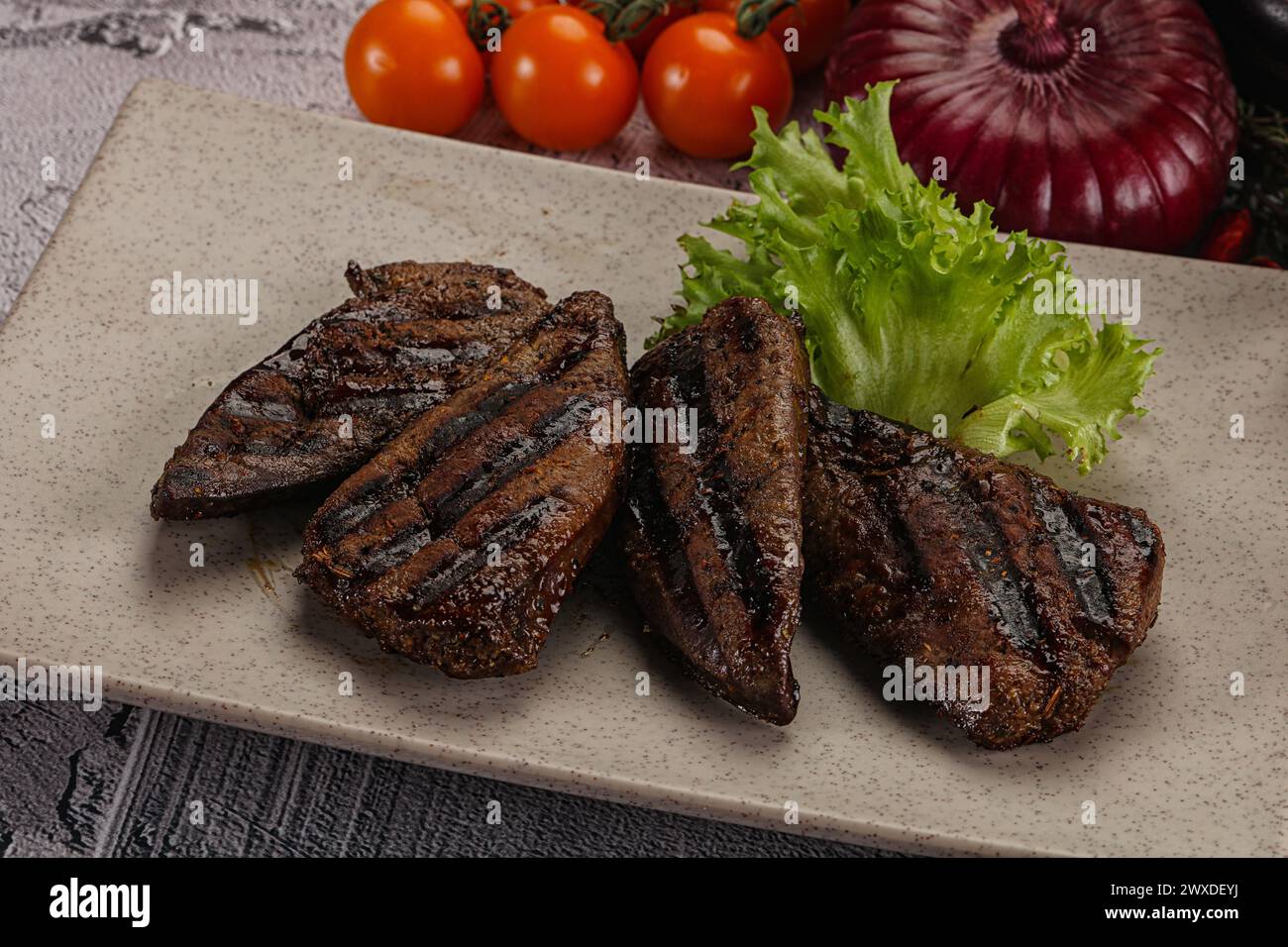 Grilled diet beef liver steak in the plate Stock Photo - Alamy