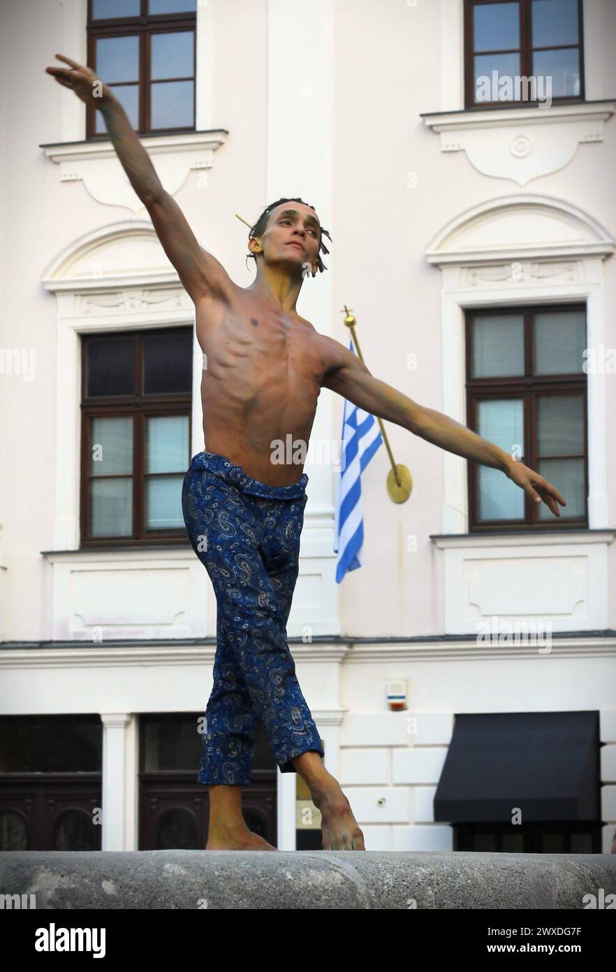 Street artist - a ballet dancer dancing on a fountain rim Stock Photo ...