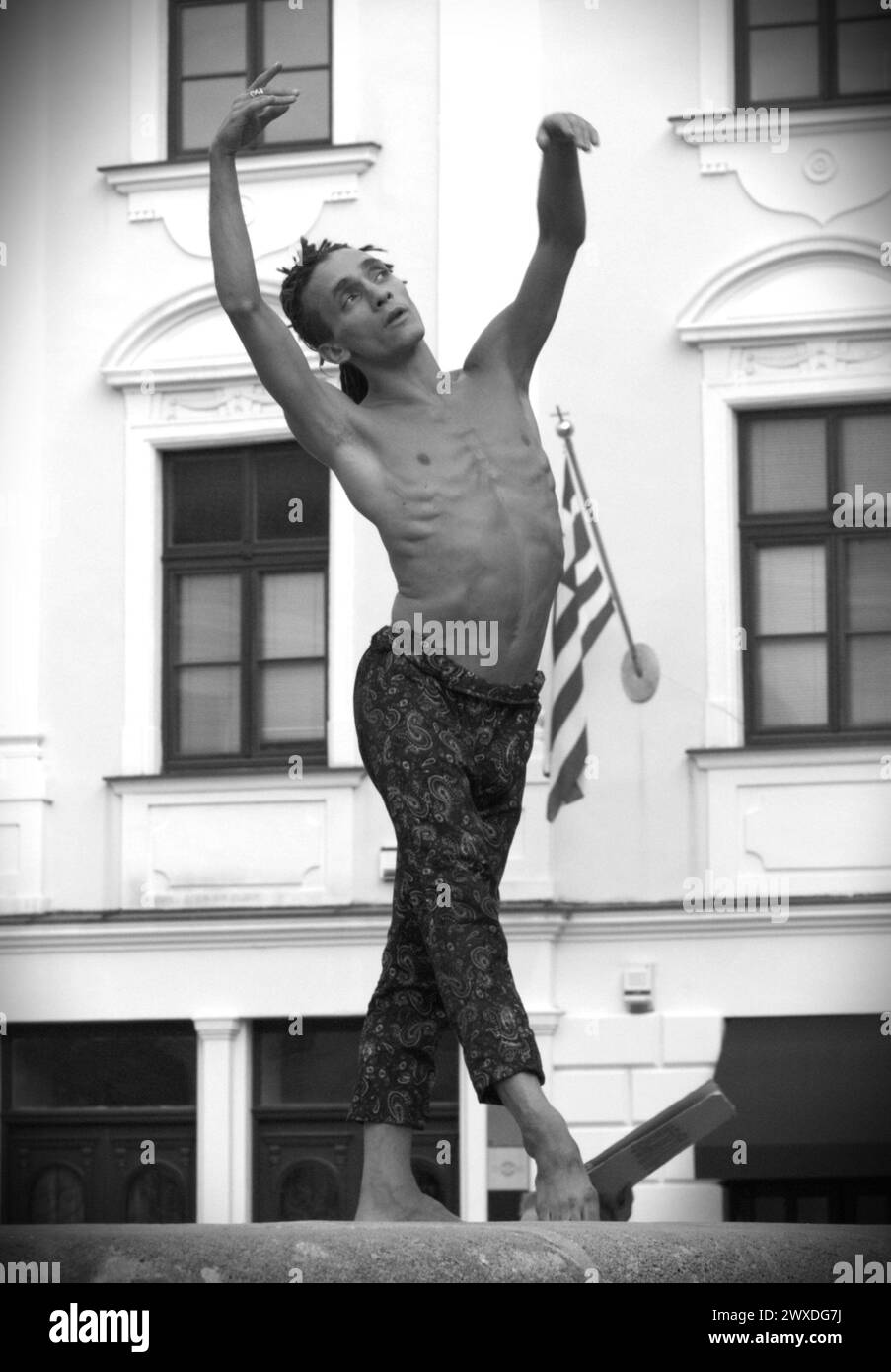 Street artist - a ballet dancer dancing on a fountain rim Stock Photo ...