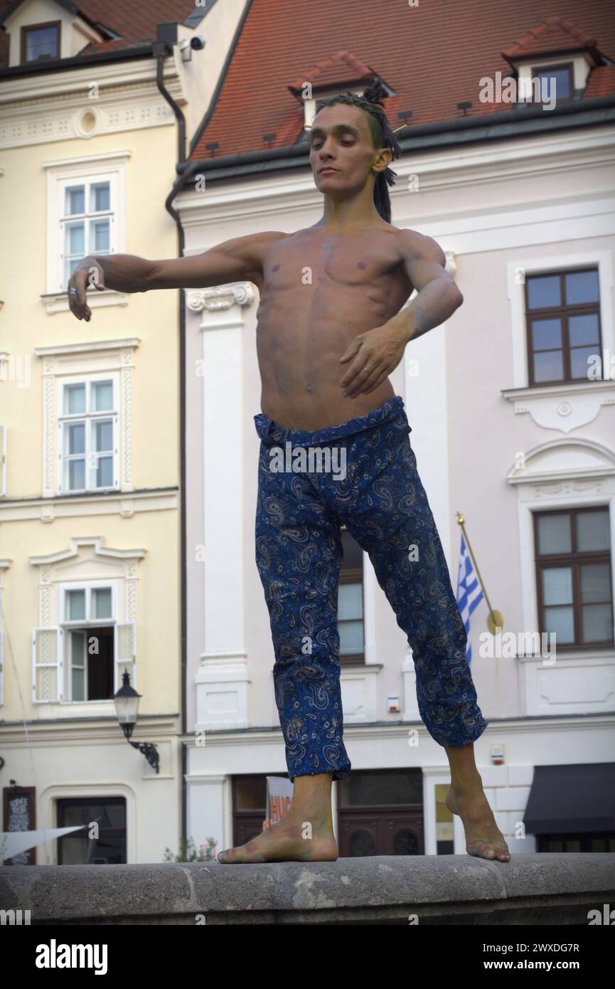 Street artist - a ballet dancer dancing on a fountain rim Stock Photo ...