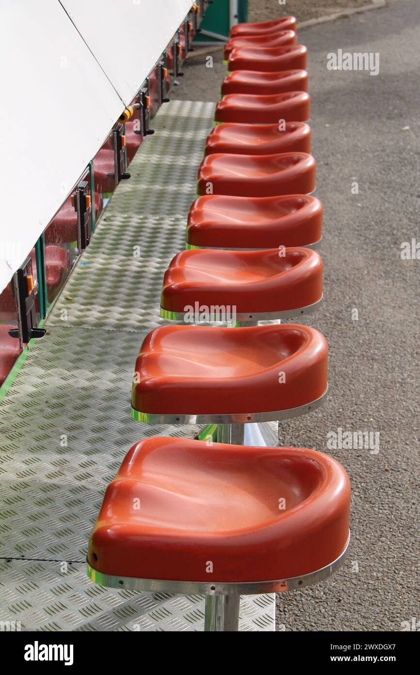 Row orange plastic chairs hi-res stock photography and images - Alamy
