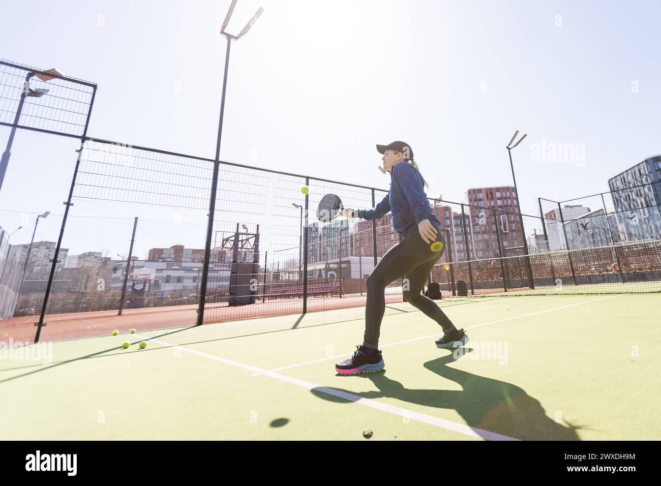 woman playing paddle tennis outdoors Stock Photo - Alamy